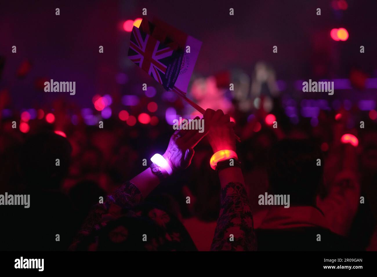 A spectator waves a UK flag during a concert at Windsor Castle in ...