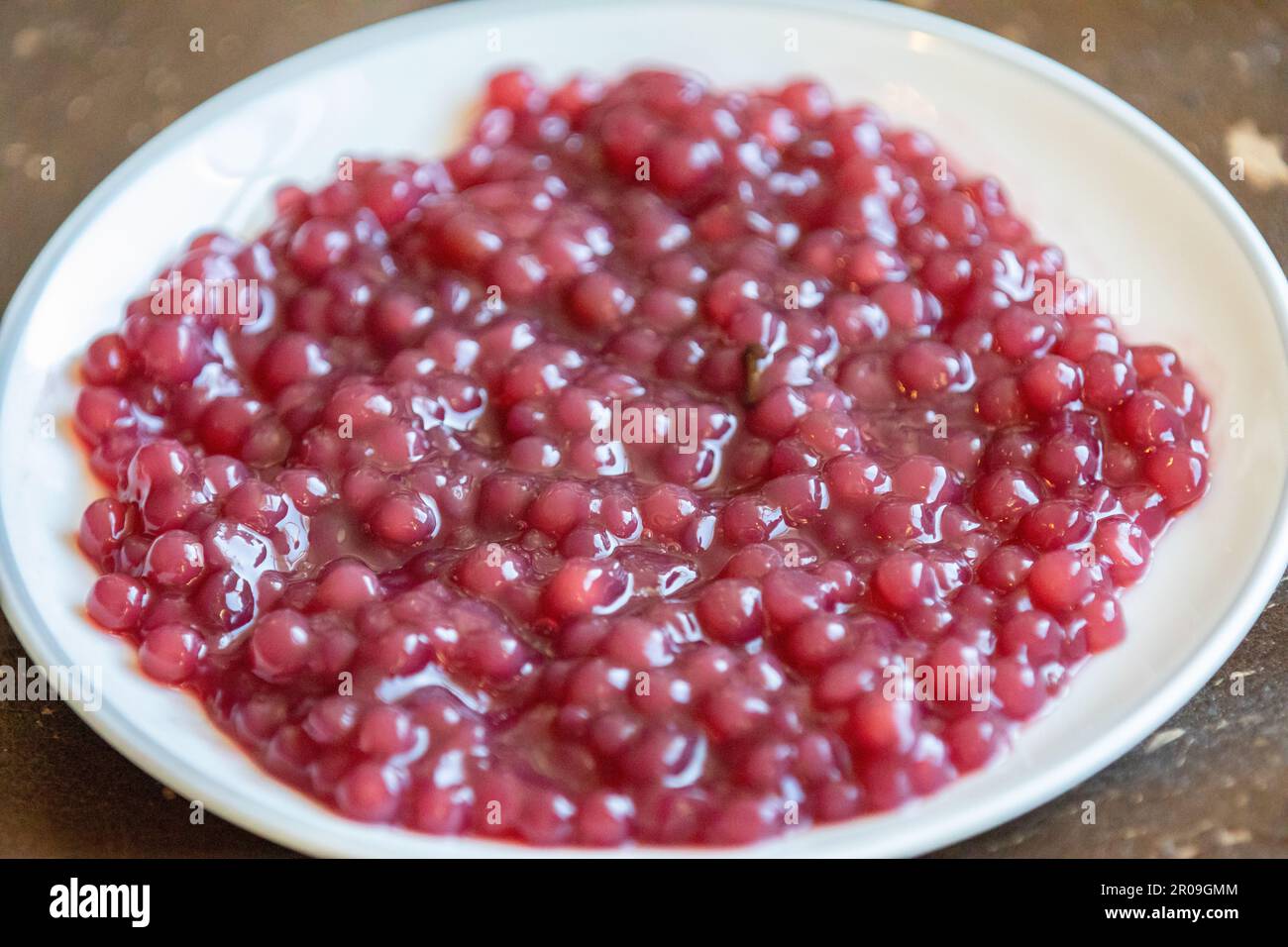 Red wine sago with vanilla cream, traditional cultural dessert from ...