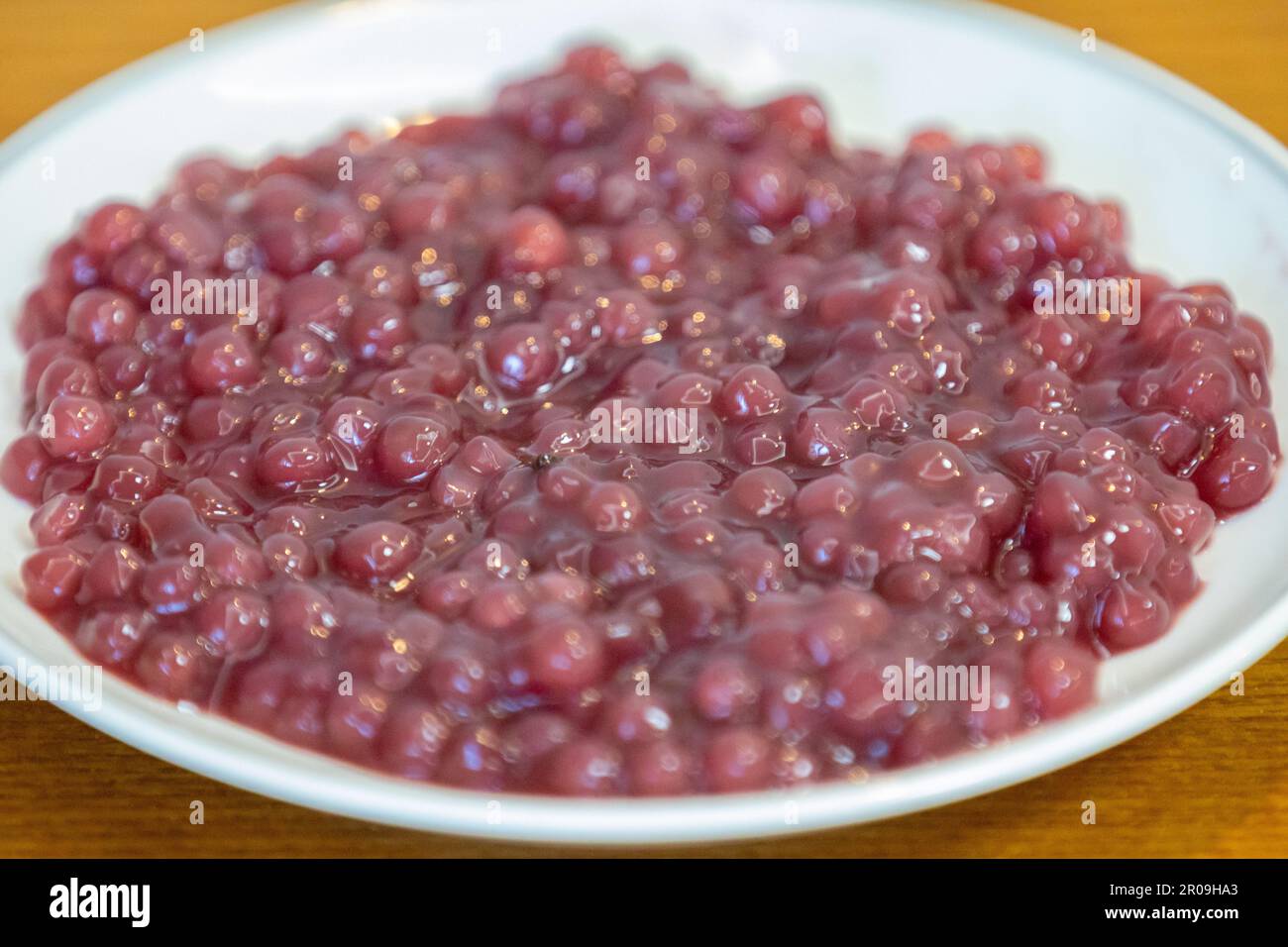 Red wine sago with vanilla cream, traditional cultural dessert from ...