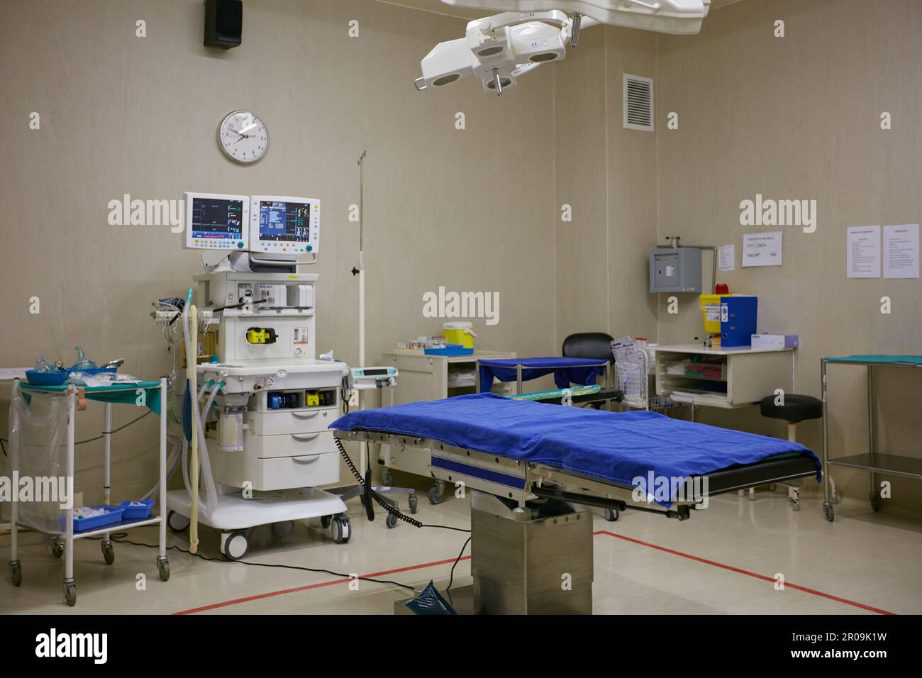 Prepped for a surgical procedure. monitoring equipment and a bed in an ...