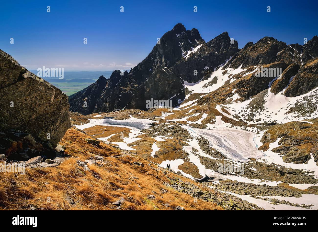 Early spring mountain landscape. Picturesque view stretches over frozen ...