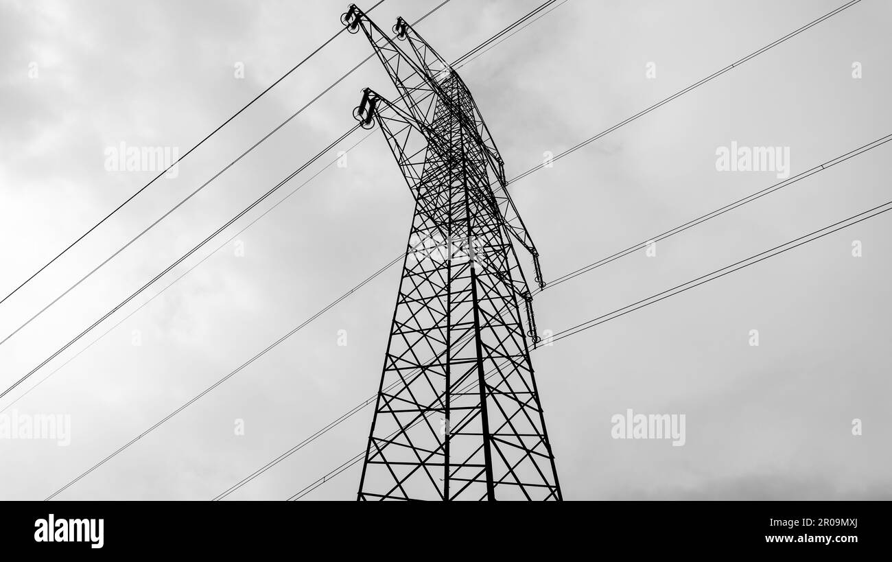 Pylon of the electricity power line on white sky background .High ...