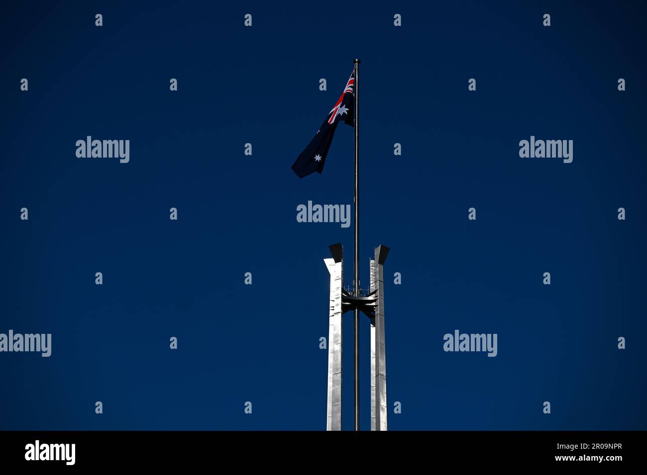 The flag post of the Australian Parliament is seen in Canberra, Monday ...