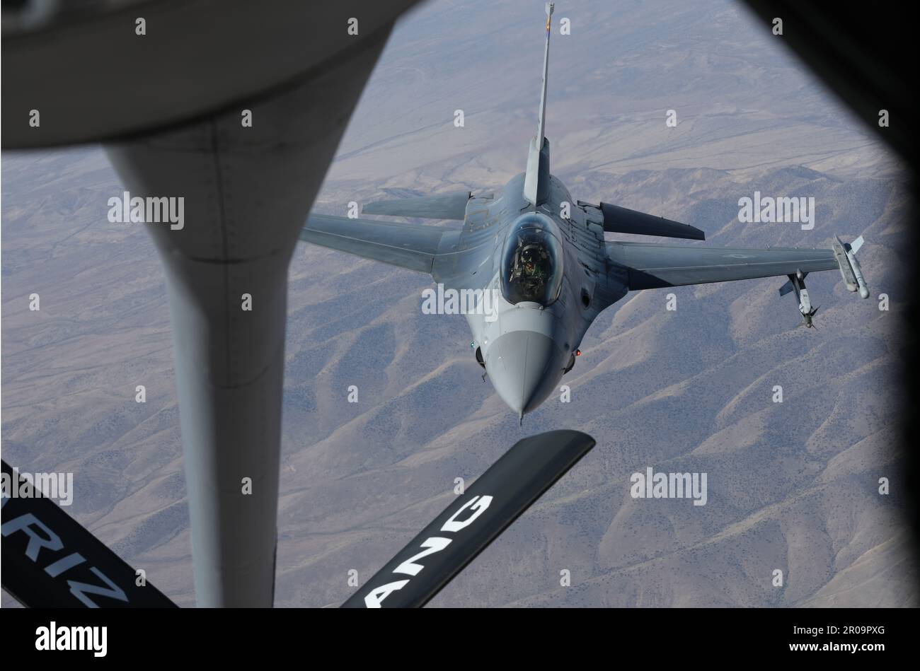 A KC-153 from the 161st Air Refueling wing refuels a F-16 Fighter Jet ...