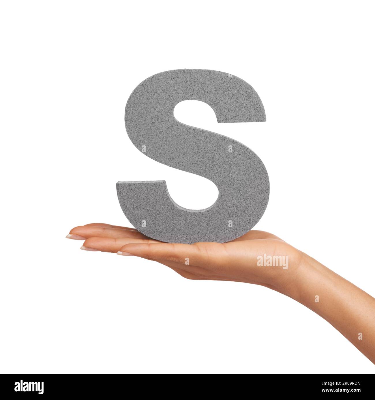 Ssss. A young woman holding a capital letter S isolated on a white ...