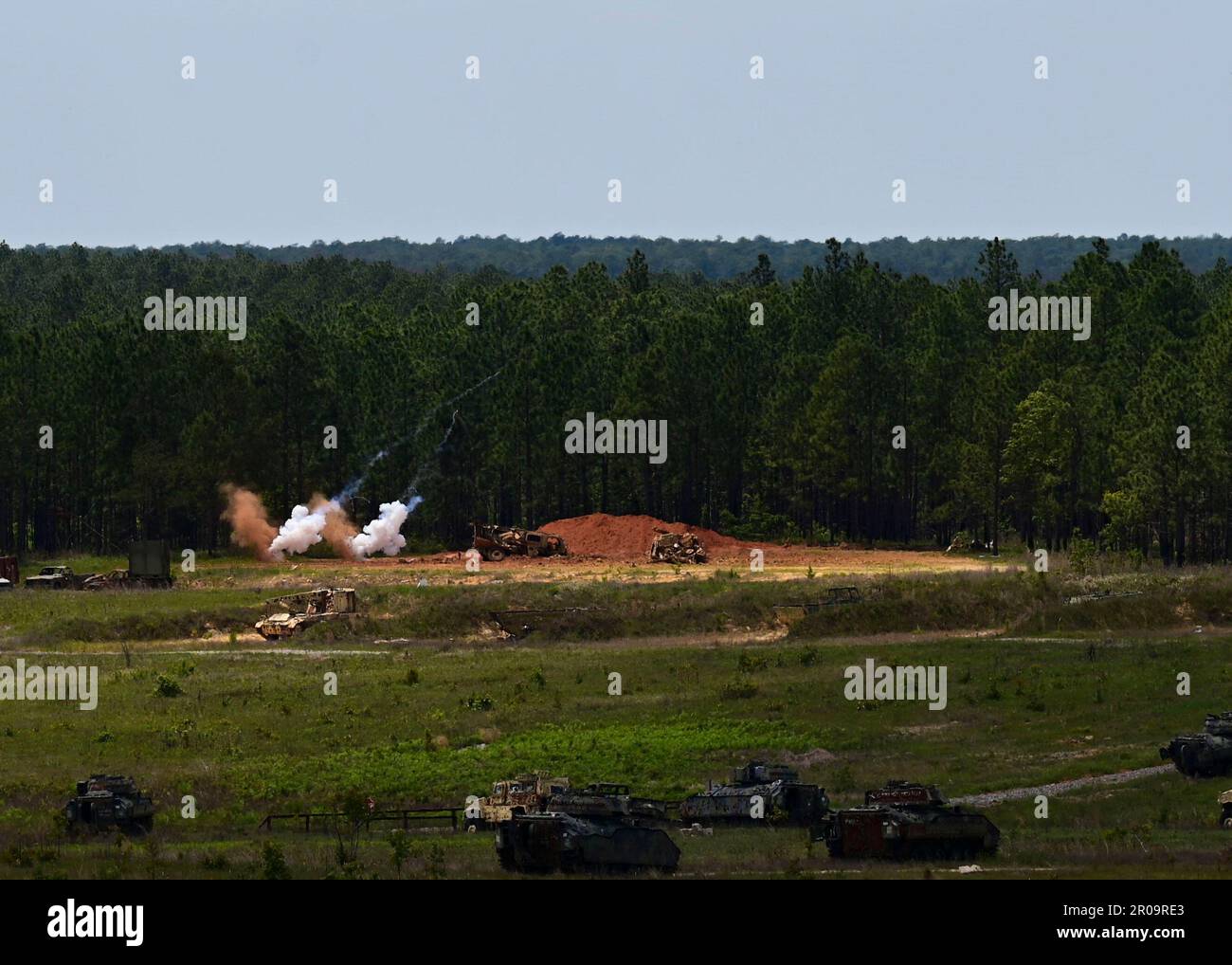 Munitions fired by a U.S. Marine Corps AV8 Harrier hits a target during ...