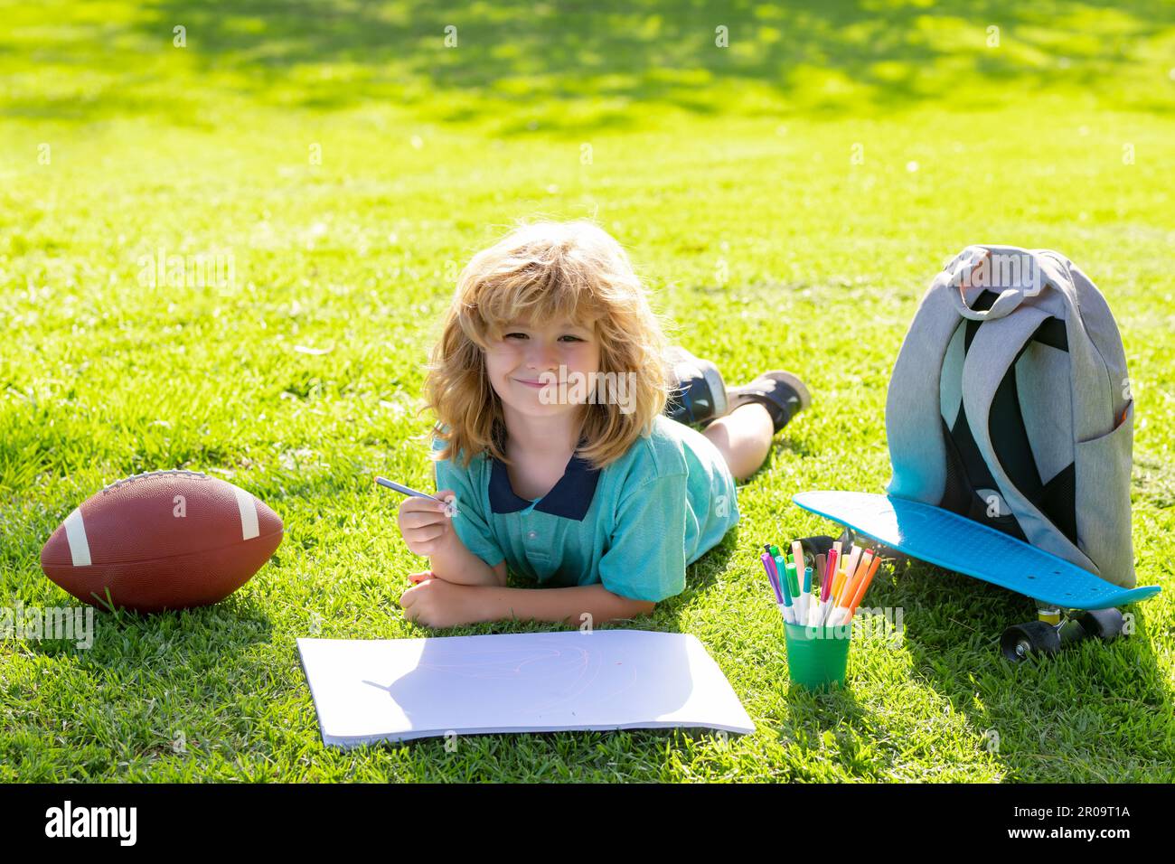 Child painter draw on playground. Child drawing picture with crayon in ...
