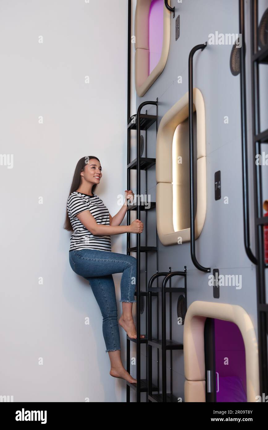 Happy young woman climbing hi-res stock photography and images - Alamy