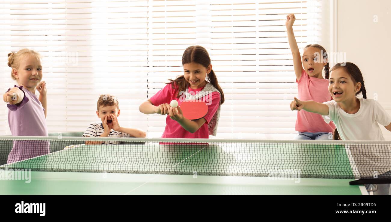 Cute happy children playing ping pong indoors. Banner design Stock ...