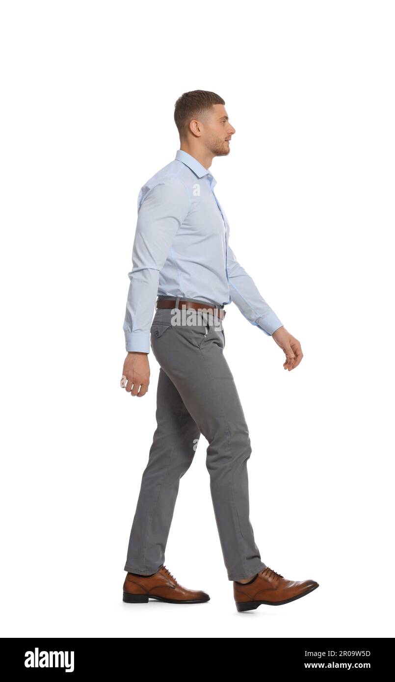 Man in formal outfit walking on white background Stock Photo - Alamy