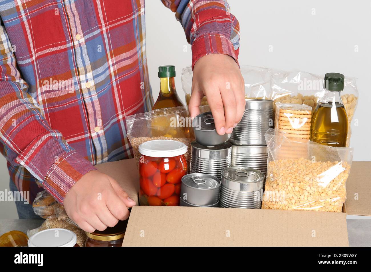Person donating goods hi-res stock photography and images - Alamy