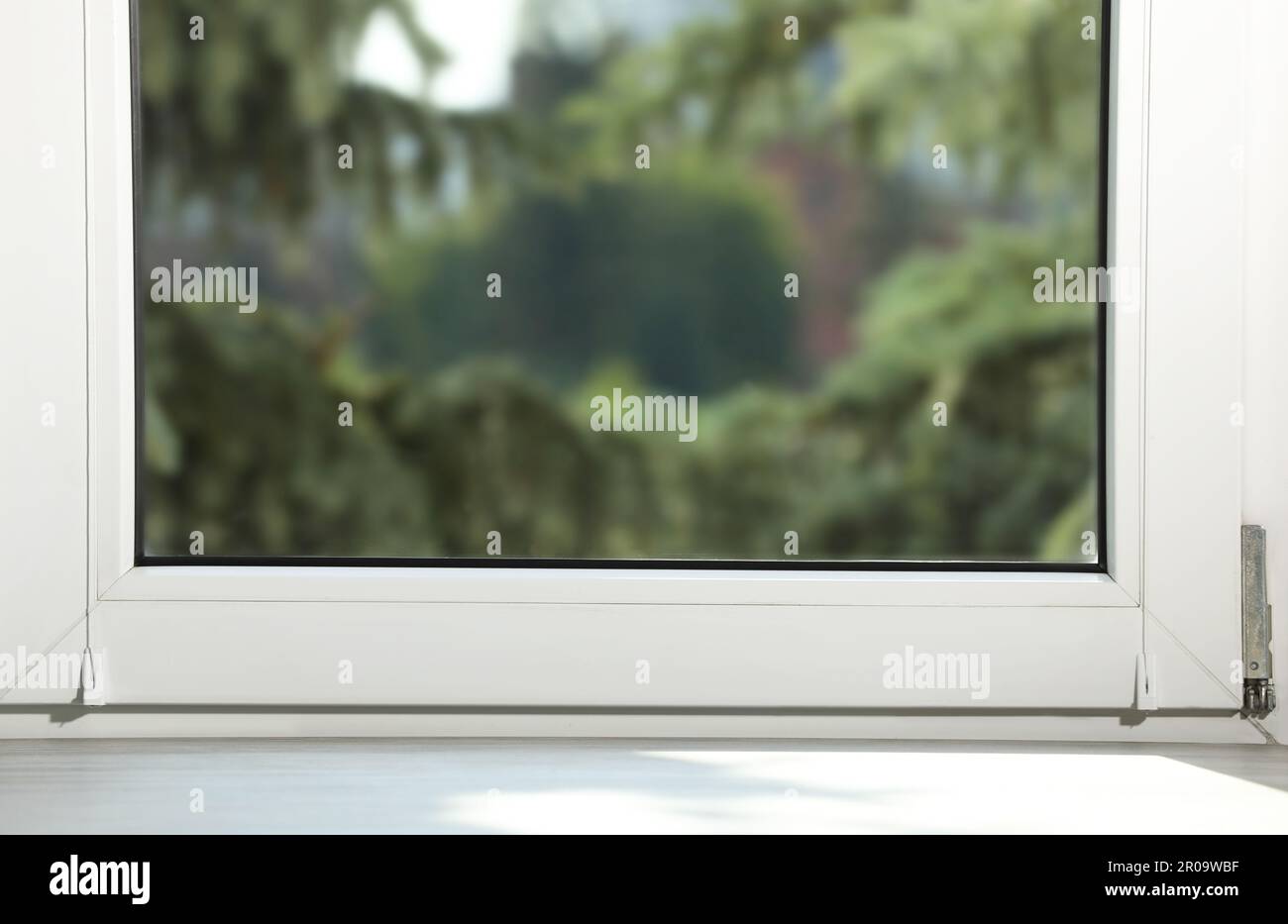 Empty wooden window sill and spruce trees outside Stock Photo - Alamy