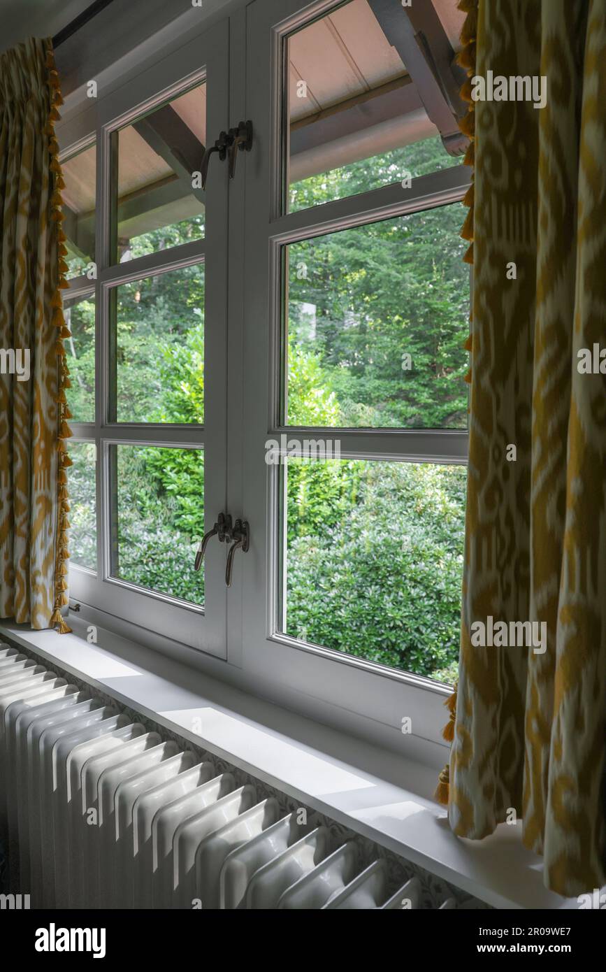 Old fashioned window with beautiful curtains in room. Interior design ...