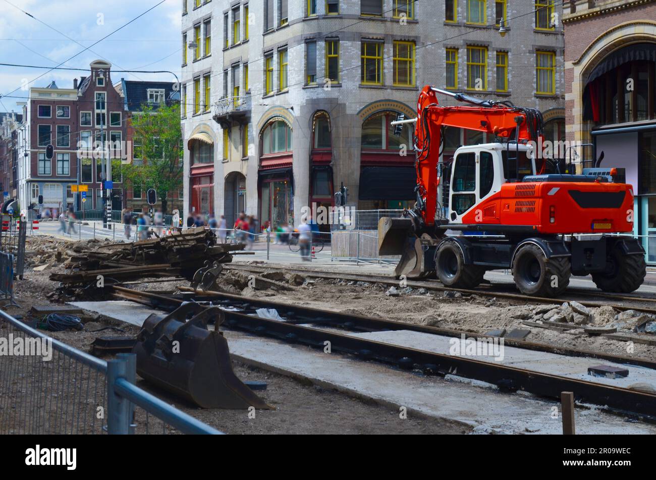 Road repair machine working on city street Stock Photo - Alamy