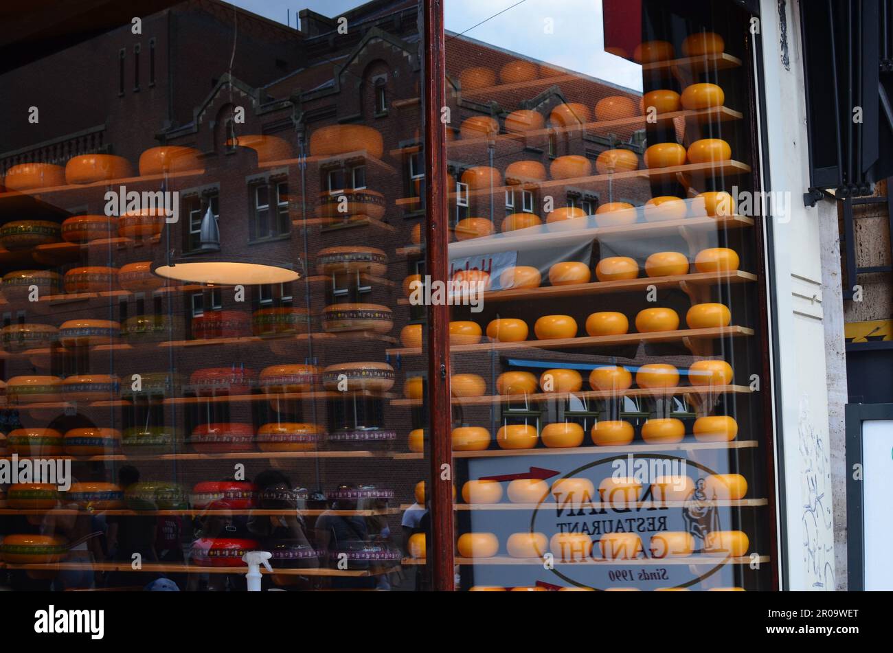 Amsterdam, Netherlands - June 25, 2022: Many cheese wheels on shelves ...