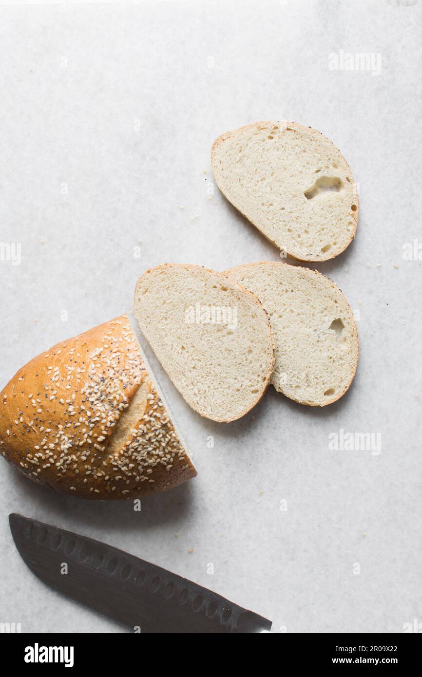 slices of artisan bread, top view of sesame coated bread slices on a ...