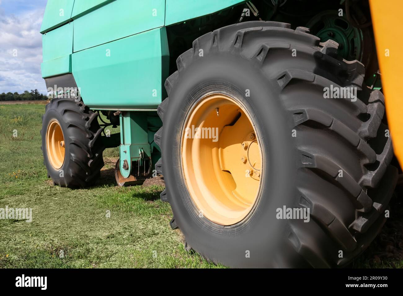 Modern combine harvester wheels outdoors, closeup view Stock Photo - Alamy