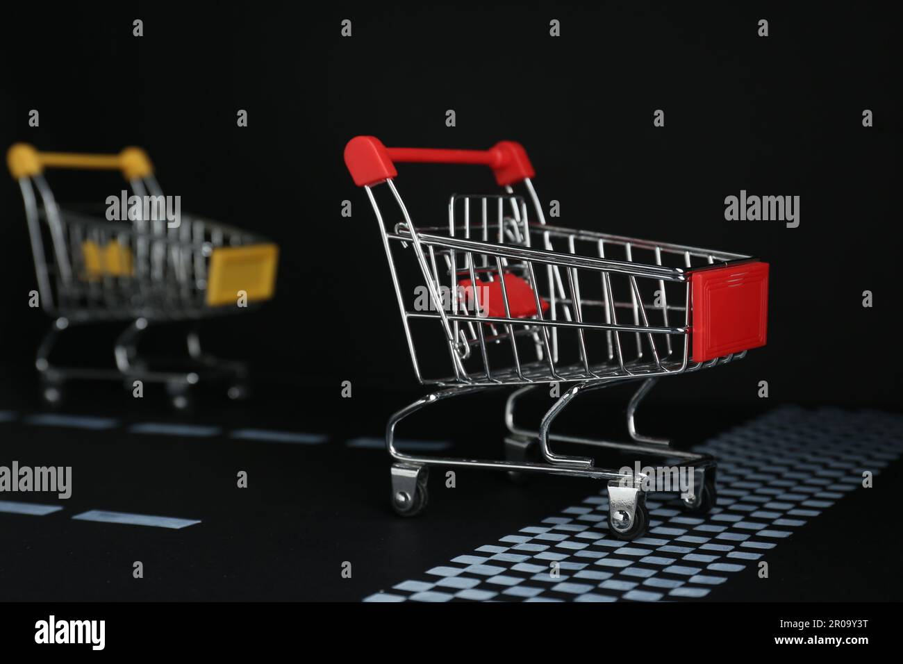Competition concept. Shopping carts racing towards finish line Stock ...