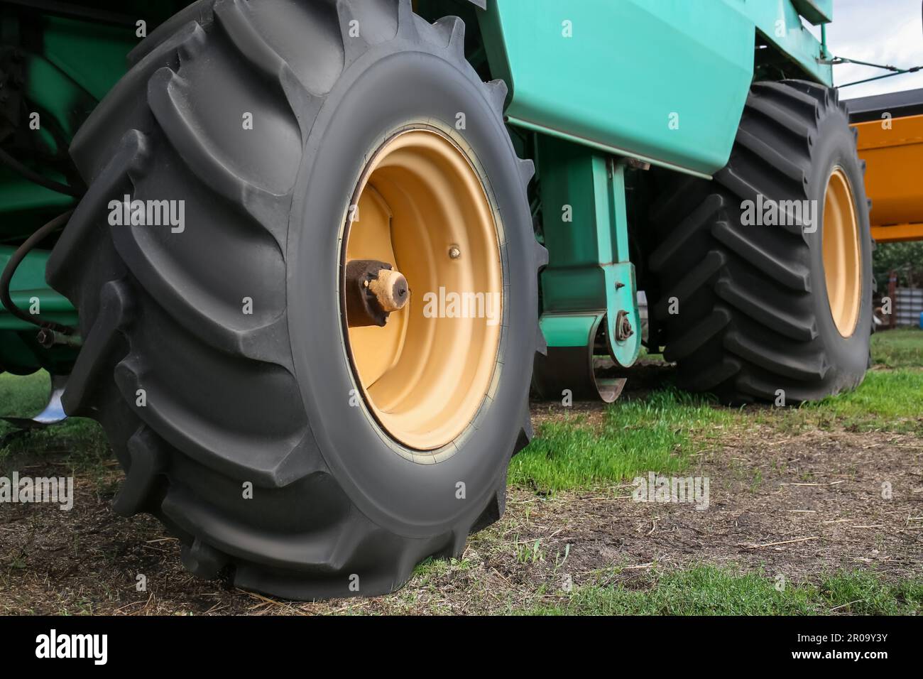 Modern combine harvester wheels outdoors, closeup view Stock Photo - Alamy