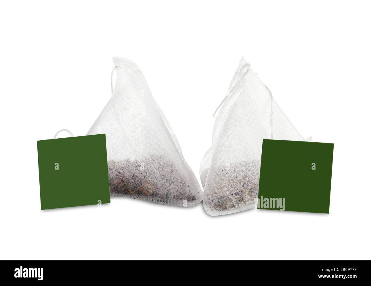 New pyramid tea bags on white background Stock Photo - Alamy