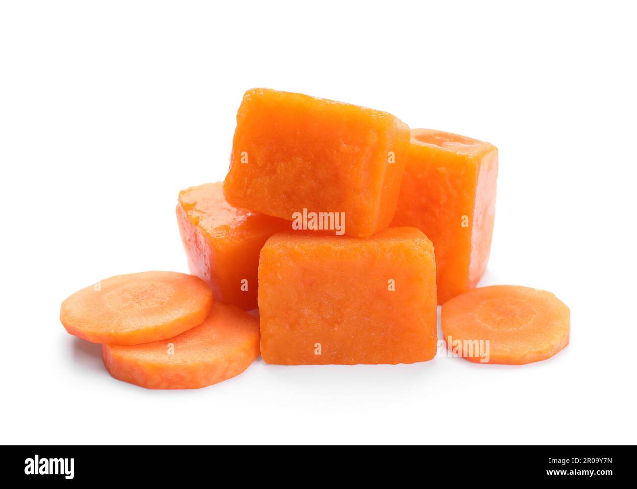 Frozen carrot puree cubes and fresh carrot isolated on white Stock ...