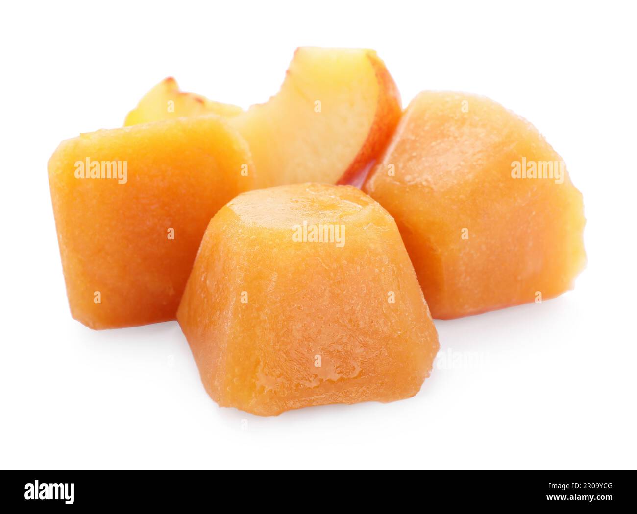 Frozen nectarine puree cubes and fruit on white background Stock Photo ...