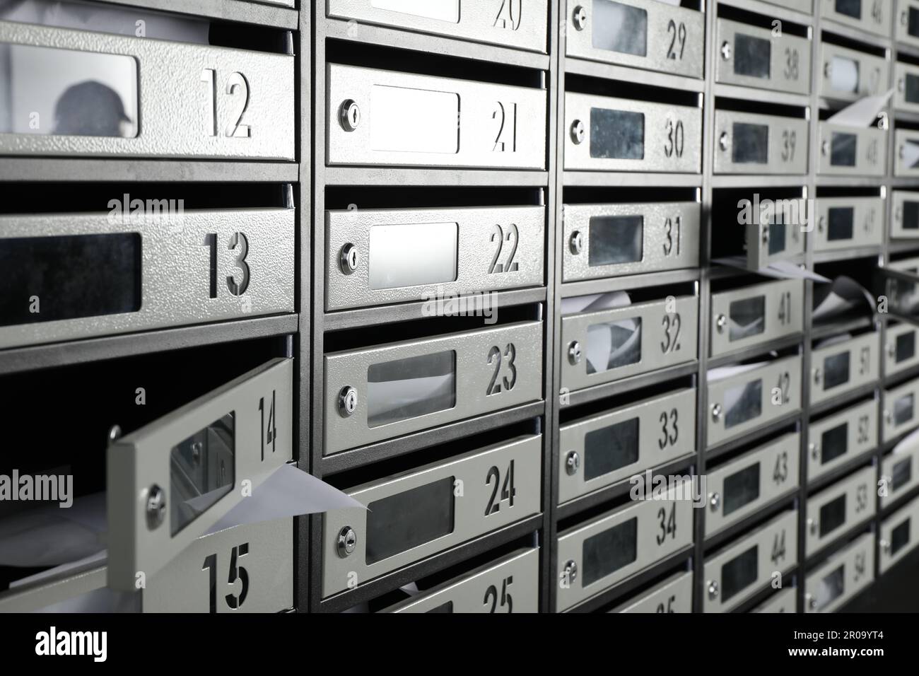 New mailboxes with keyholes, numbers and receipts Stock Photo - Alamy