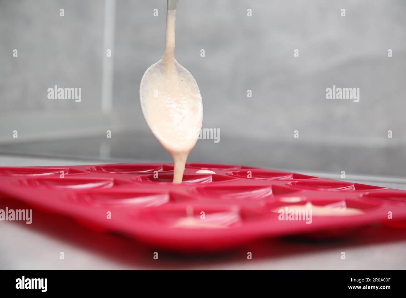 Woman pouring homemade raw batter hi-res stock photography and images ...