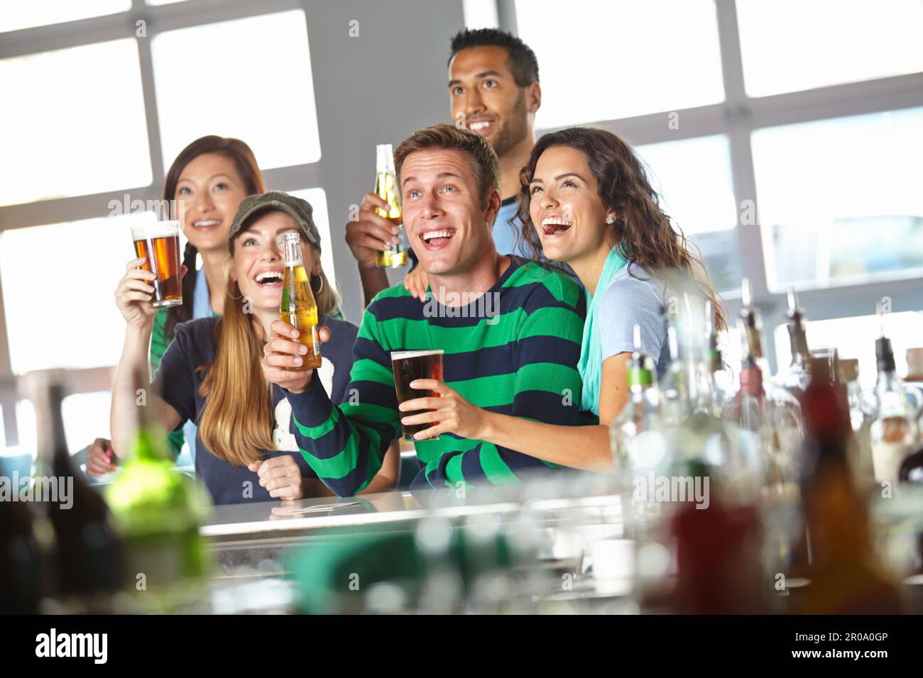 Wow, what a game... lets celebrate. A group of friends cheering on ...
