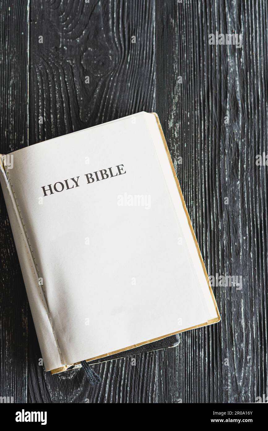 The Bible with spring flowers on a wooden background. Concept for faith ...