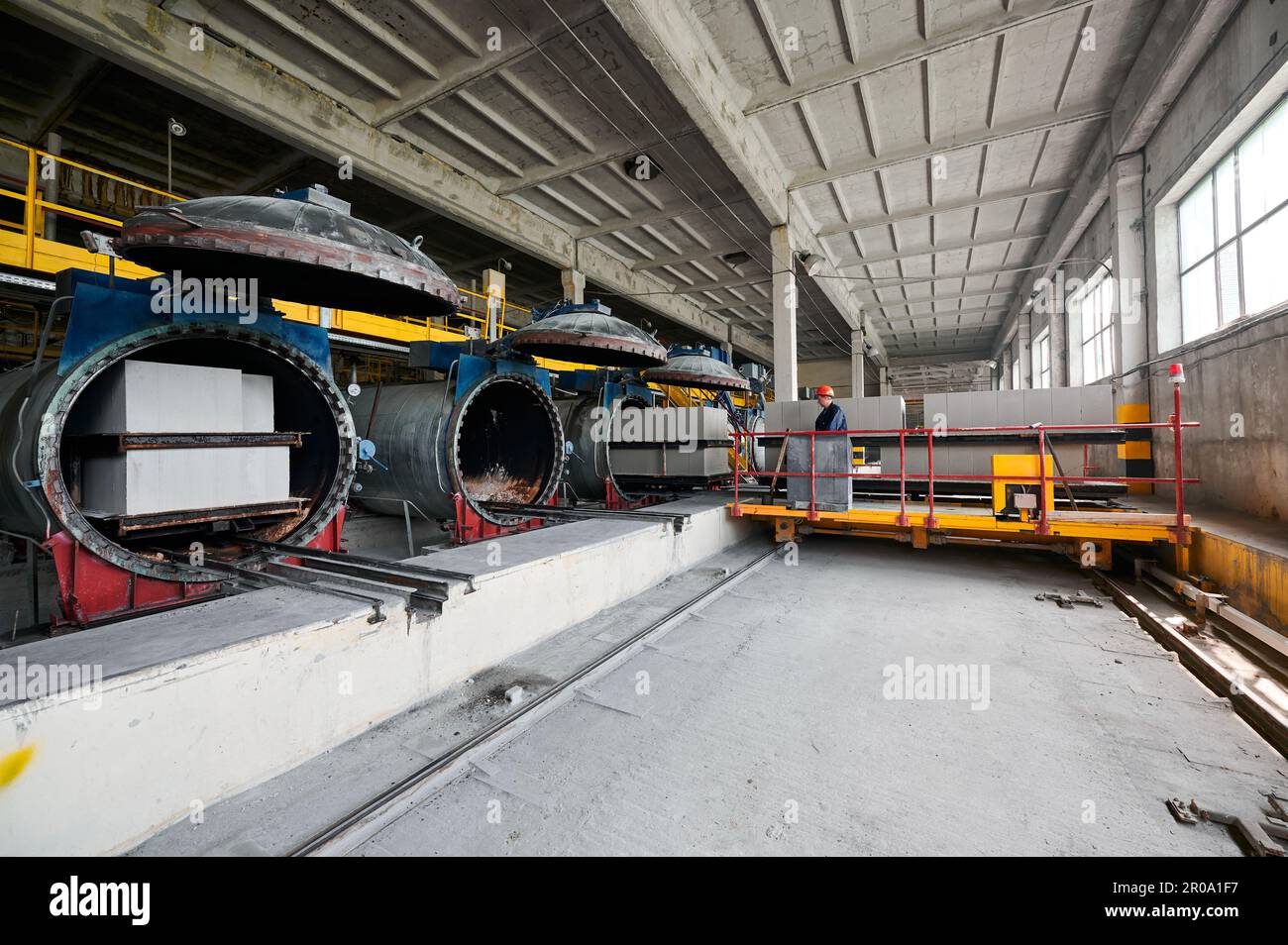 Raw blocks loaded into open tanks for material hardening Stock Photo ...