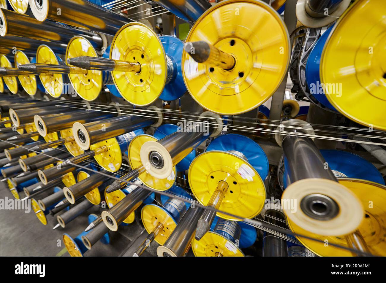 Bobbins coil thin wire to reinforce tires in plant workshop Stock Photo ...