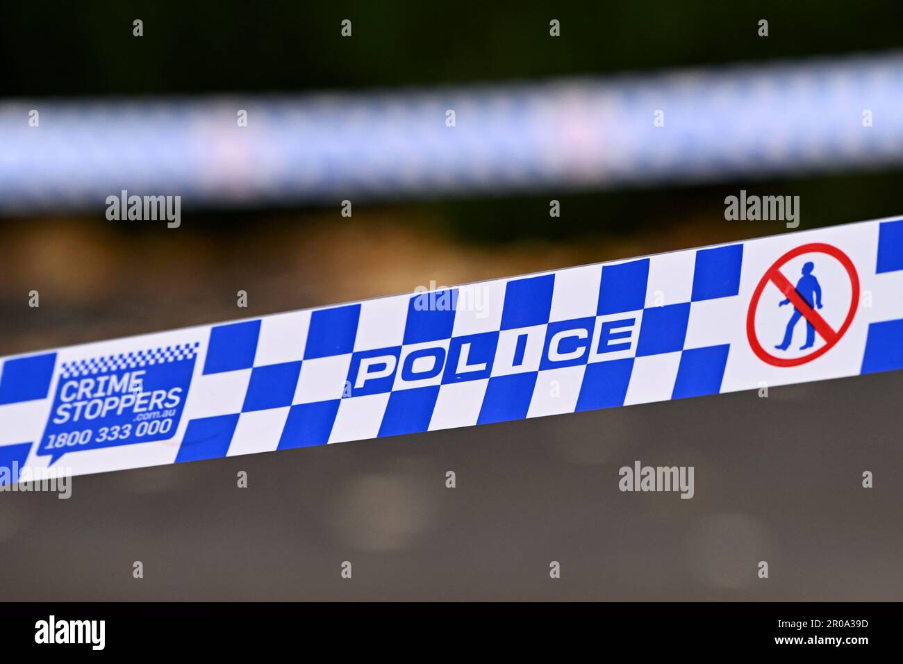 Victoria Police tape restricts access to a crime scene in Melbourne ...