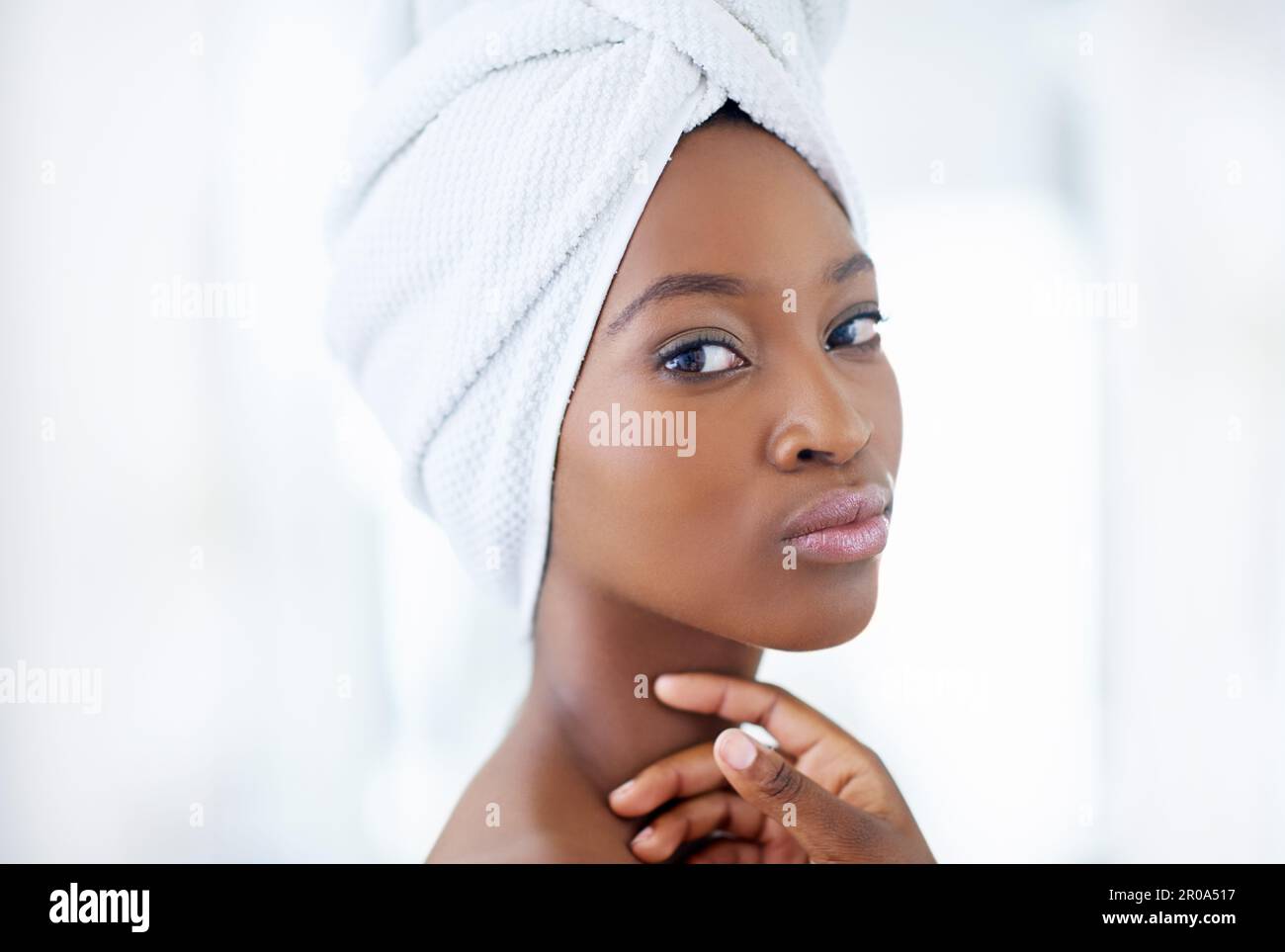Treat it with care. a beautiful young woman during her daily beauty ...