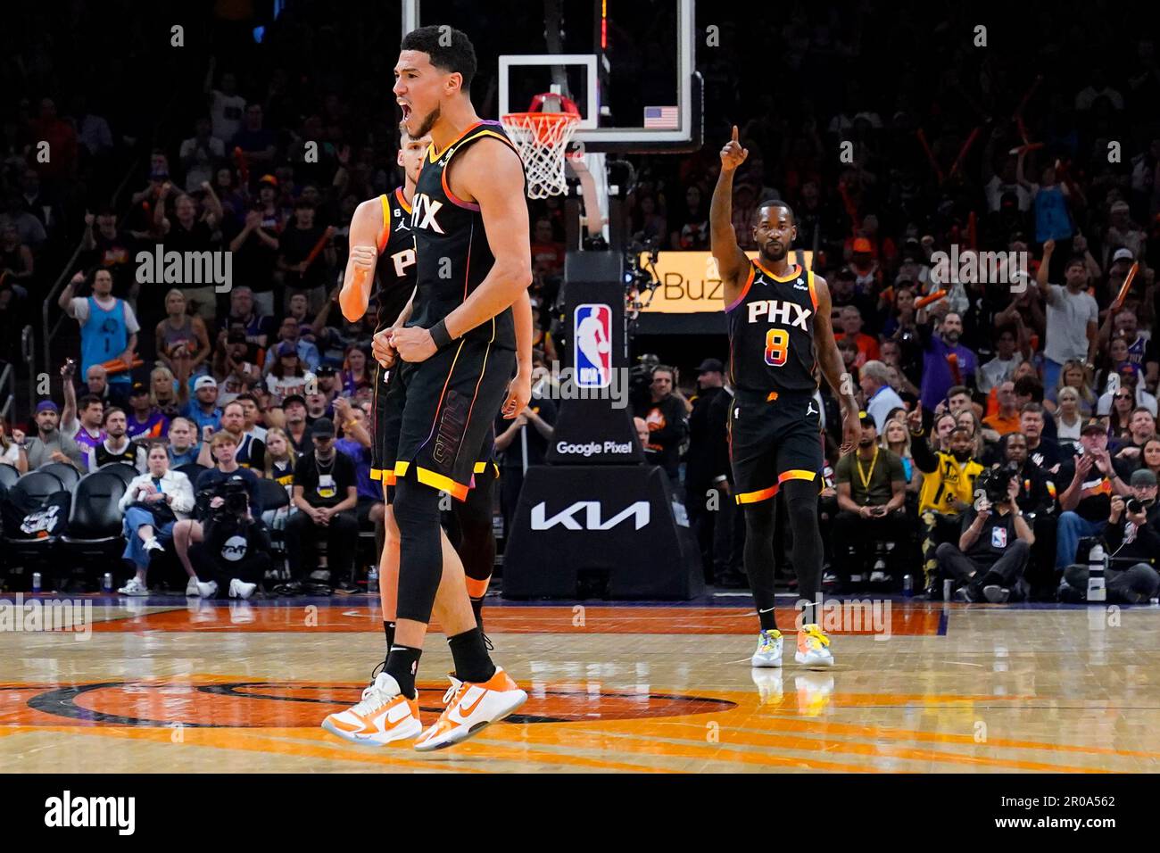 Phoenix Suns guard Devin Booker celebrates a basket against the Denver ...