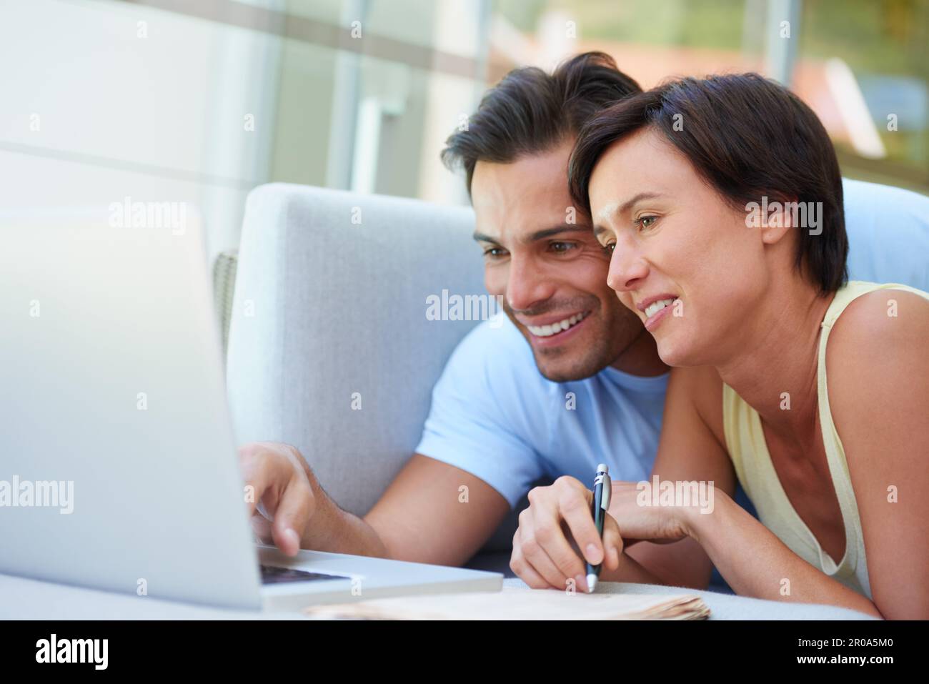 Working together on their finances. a married couple working on their ...