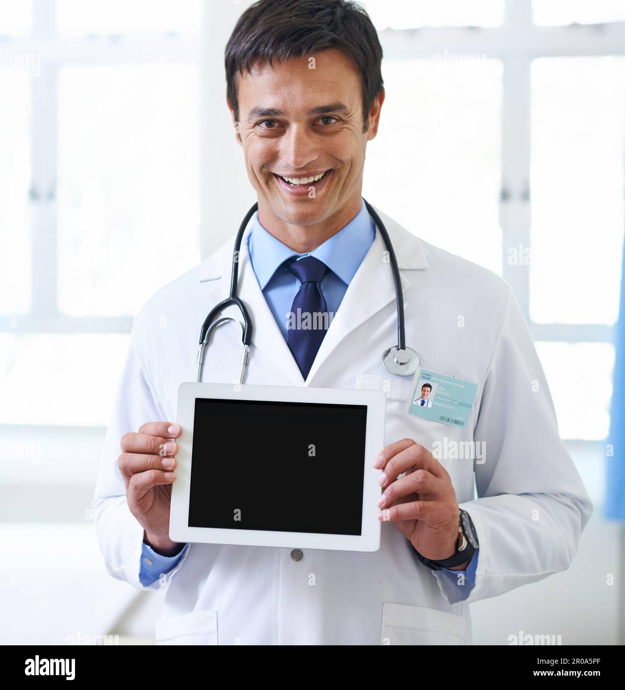 The doctors new best friend. Portrait of a handsome young doctor ...