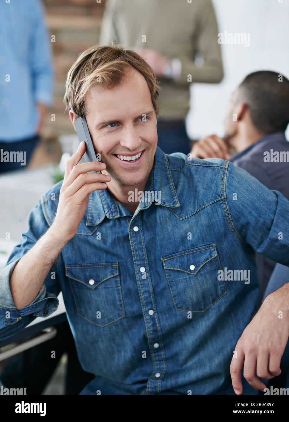 You called the right man for the job. a coworkers in a business meeting ...