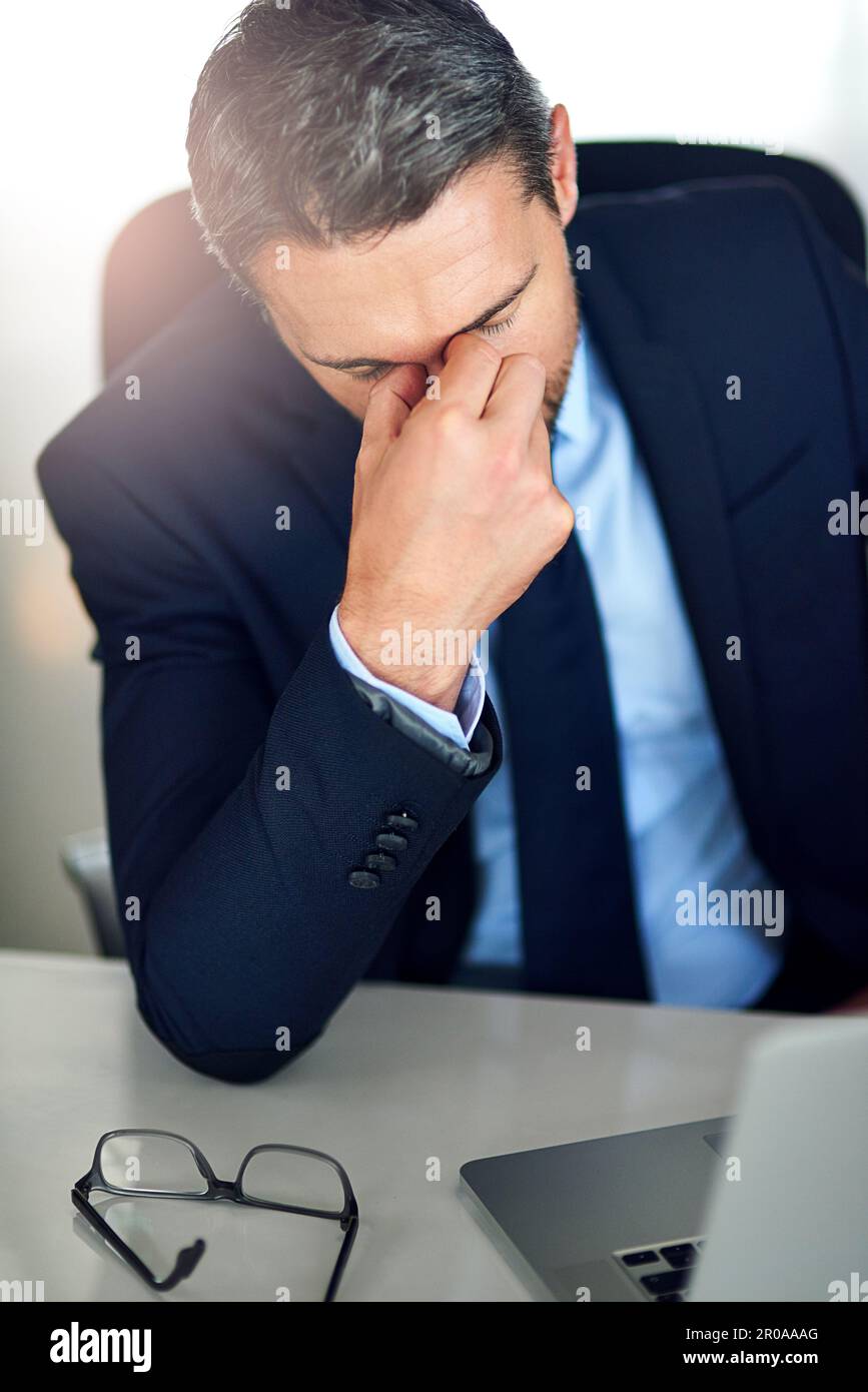 When work becomes a nightmare. a businessman experiencing stress at the ...
