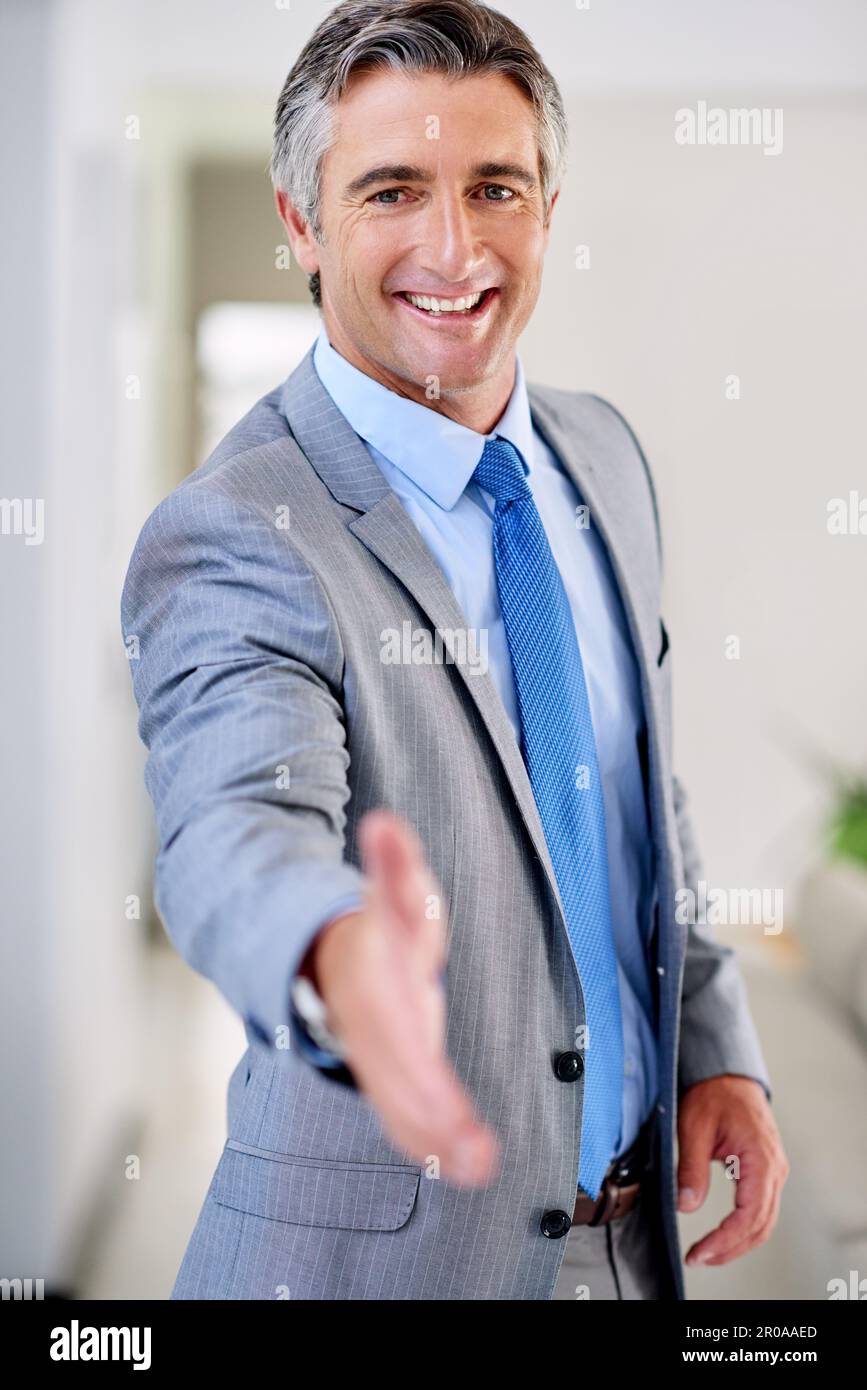 Lets shake on it, shall we. Portrait of a mature businessman wearing a ...