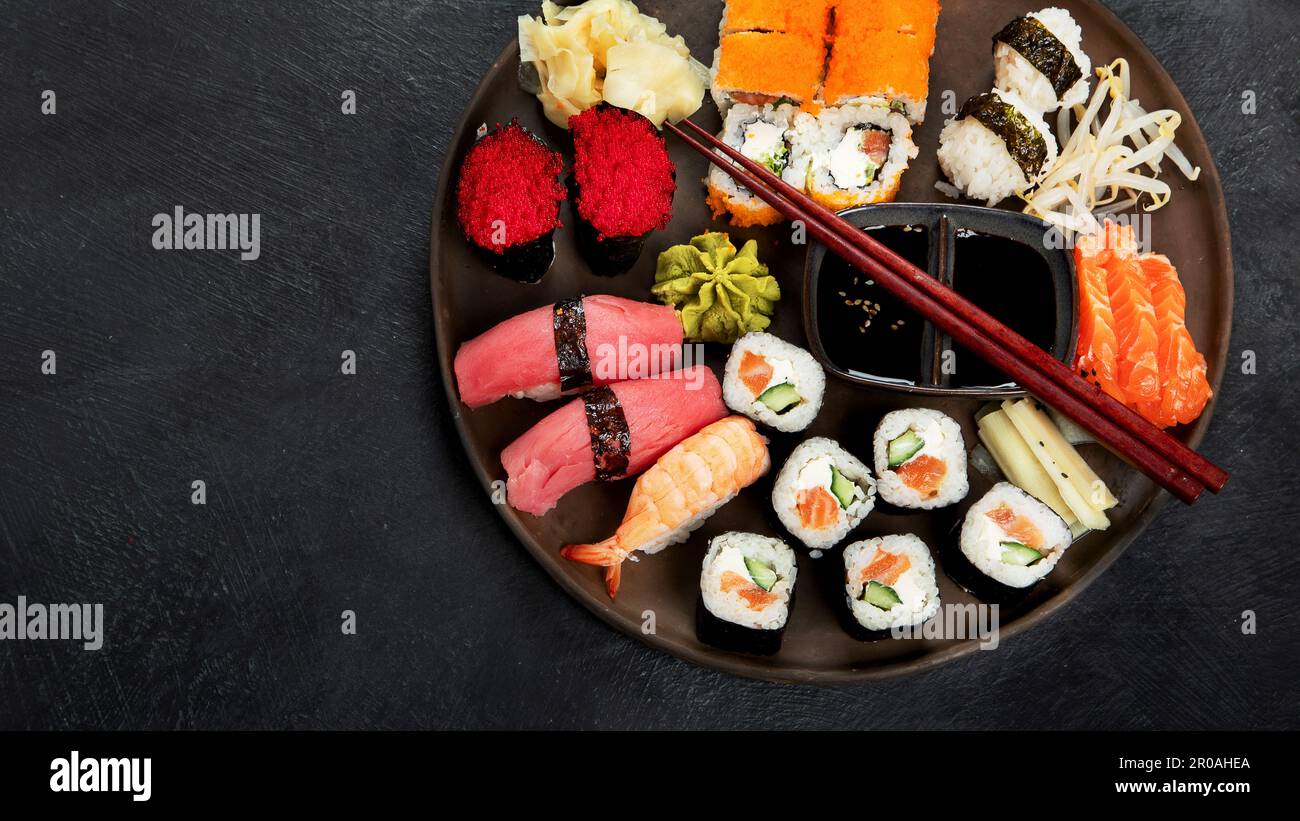 Traditional Japanese food dishes on black background, top view, copy ...