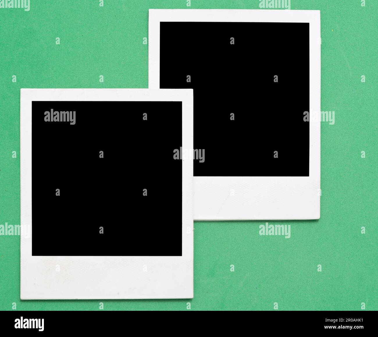 Polaroid photo frames on green background Stock Photo - Alamy