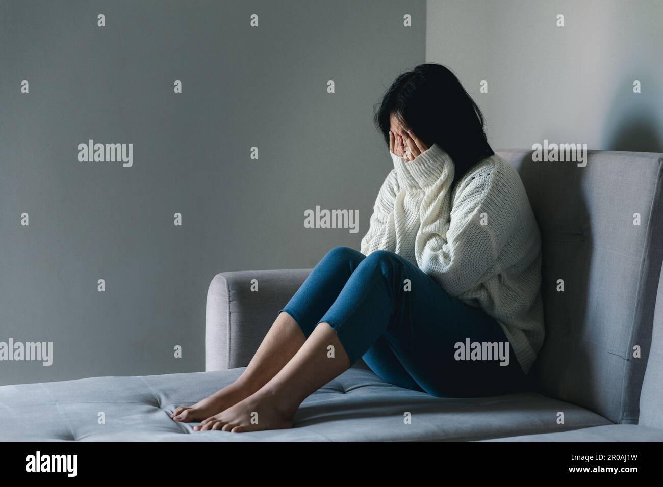 Concept of sad teenage girl depression. Upset teenage girl sitting at ...