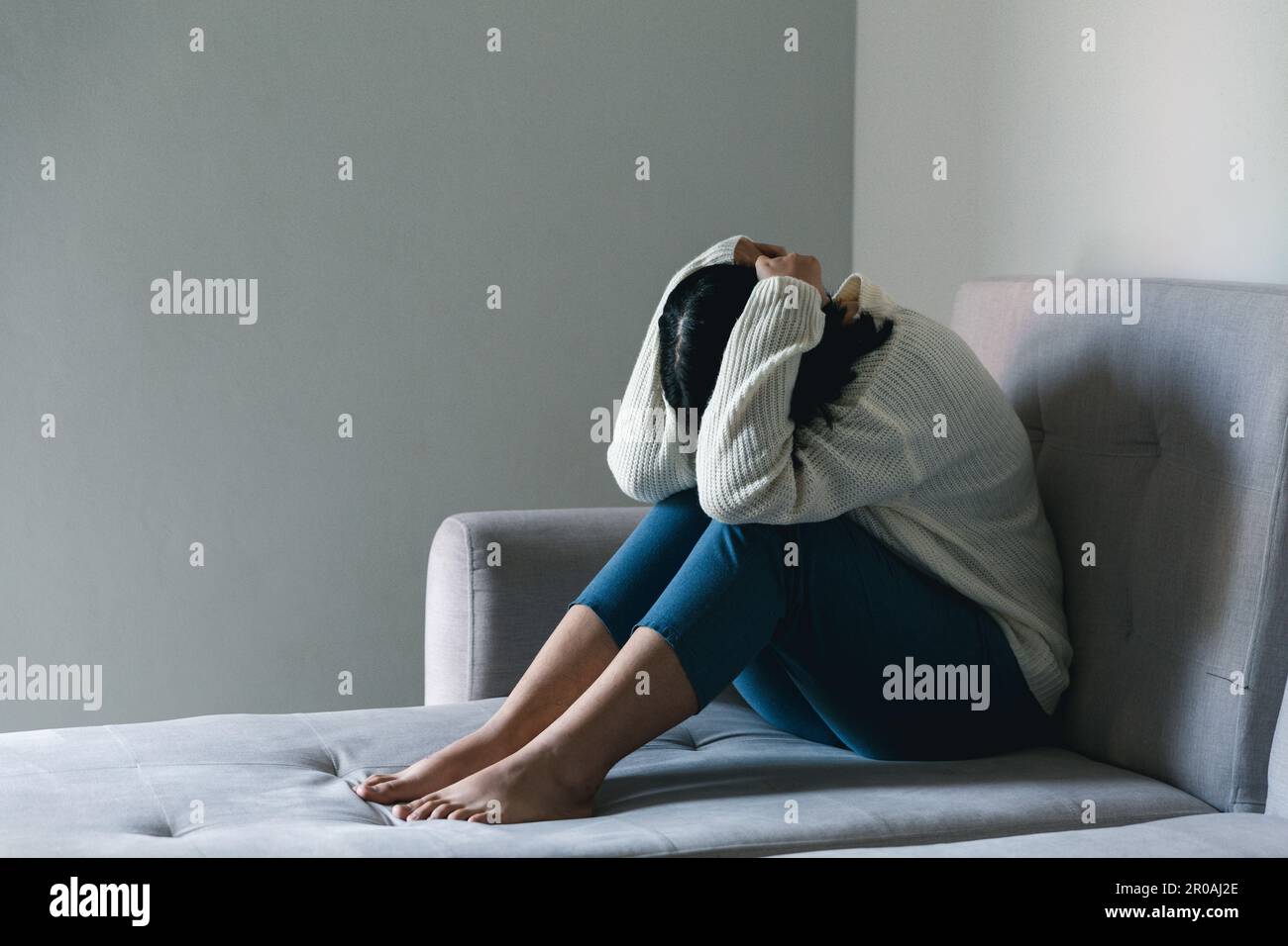 Concept of sad teenage girl depression. Upset teenage girl sitting at ...