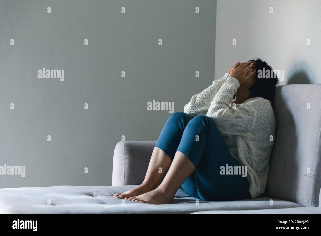 Concept of sad teenage girl depression. Upset teenage girl sitting at ...