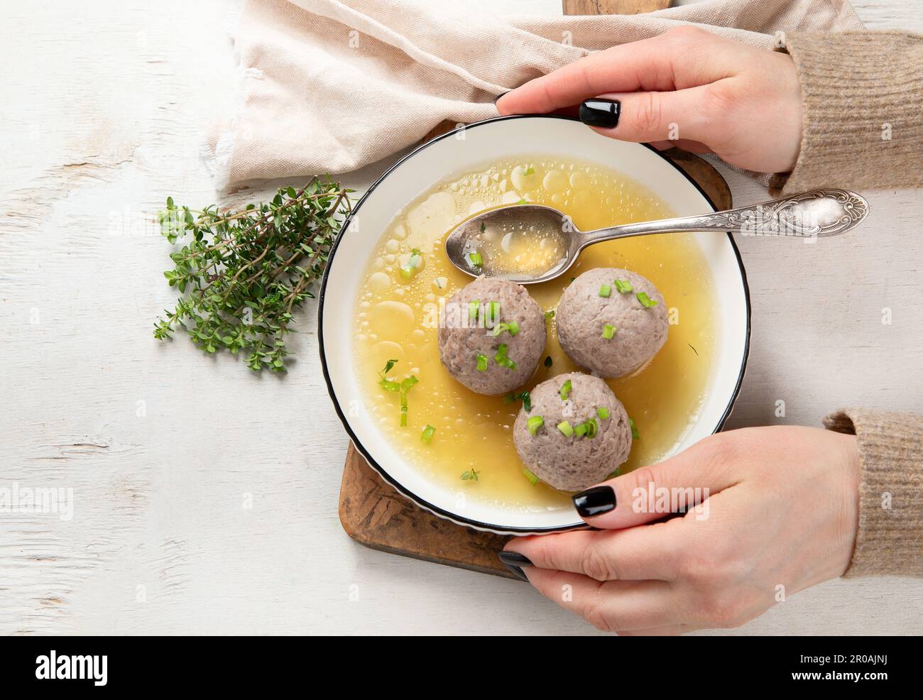 Canederli or Knodel in broth with green onion, typical pasta or ...