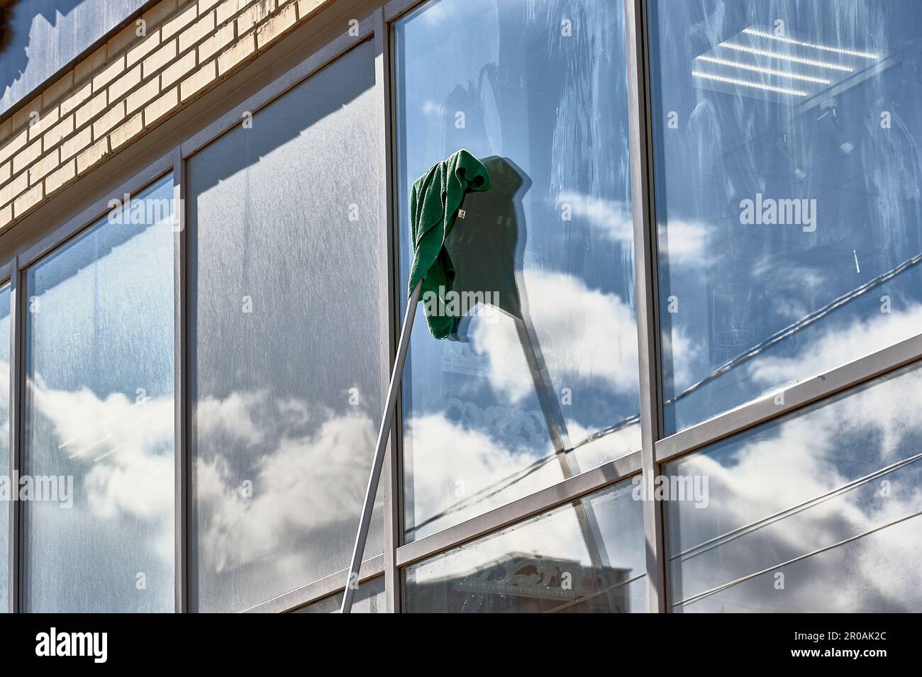window washing, washing a street shop window Stock Photo - Alamy