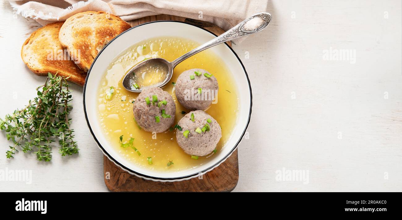 Canederli or Knodel in broth with green onion, typical pasta or ...