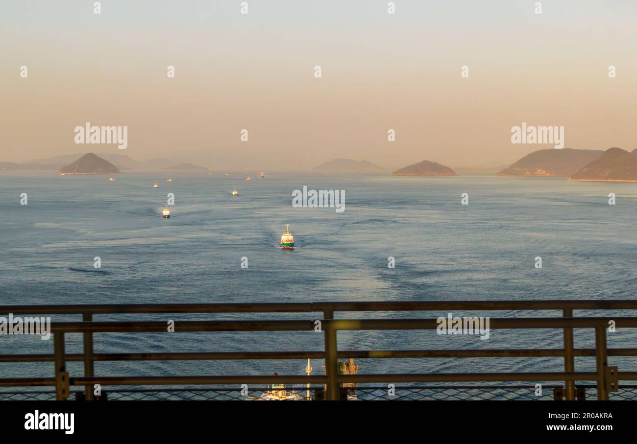 Scenic evening seascape with the islands and boats crossing Seto Inland ...