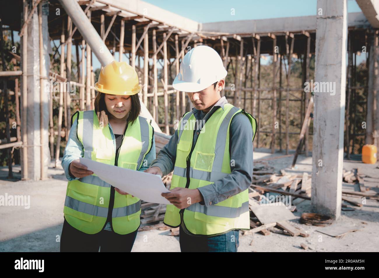 Two specialists inspect commercial, Industrial building construction ...